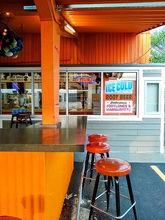 Where nostalgia meets hunger: the counter service window with its vintage signage promising "ICE COLD ROOT BEER" delivers on every syllable.