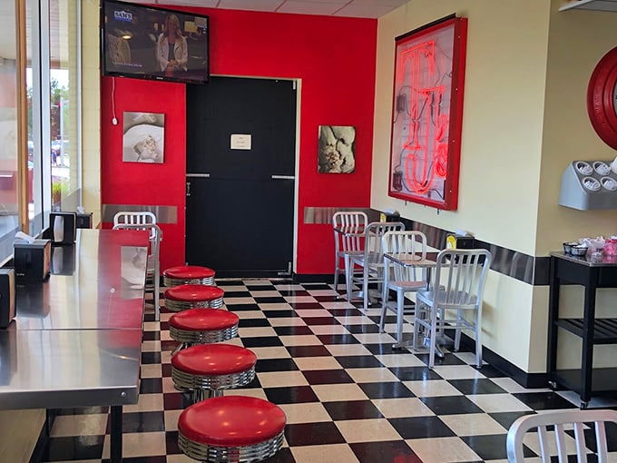 The classic diner-style counter seating and checkerboard floor create that perfect "I've discovered somewhere special" feeling that makes food taste even better.
