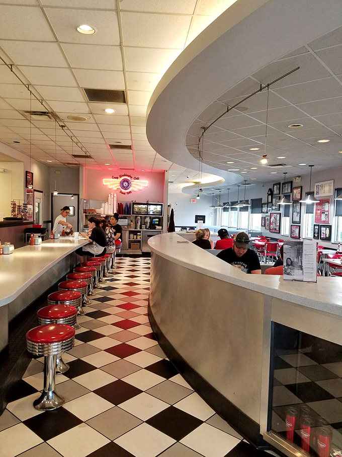 The curved counter and classic diner stools invite solo diners and regulars to become part of the Camp Washington family.
