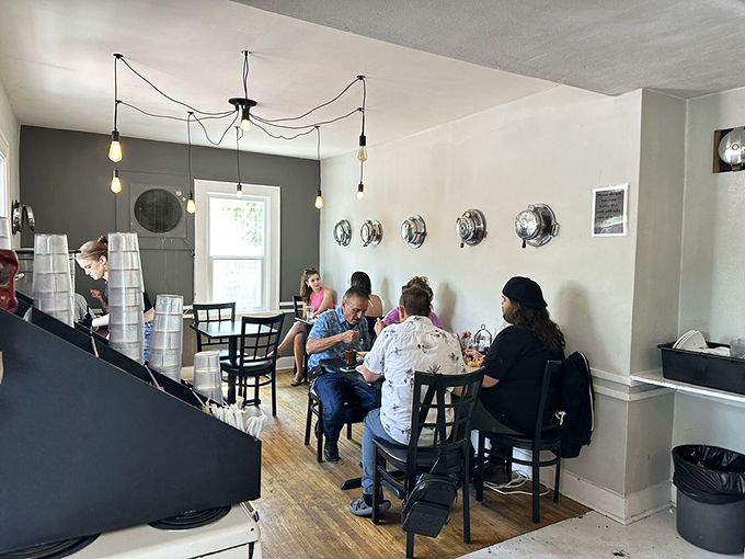 The dining room hums with the universal language of waffle appreciation—forks poised, coffee steaming, and conversation flowing.
