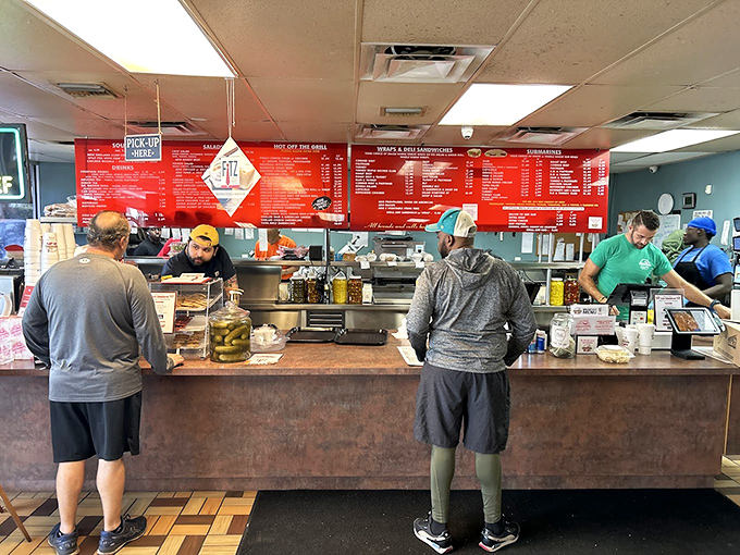 The counter at Mr. M's&mdash;where sandwich dreams become reality. Notice how everyone stands with the posture of anticipation.