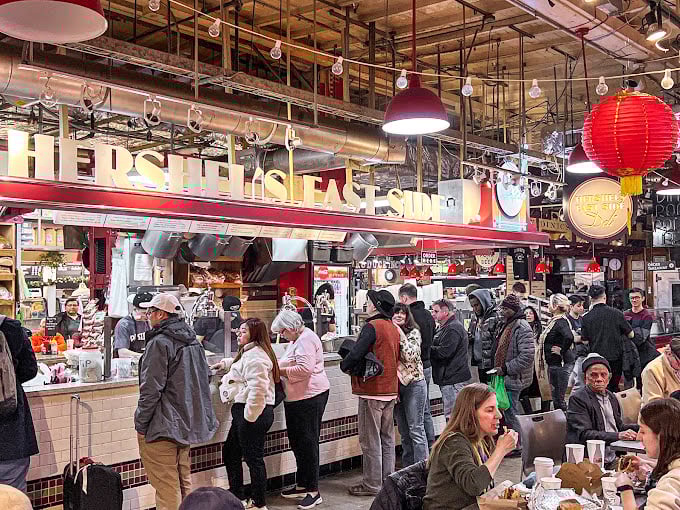 The diverse crowd shares one common language: appreciation for authentic deli fare. This isn't just eating&mdash;it's participating in a delicious cultural exchange.