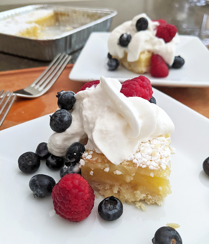 Berries and cream transform a simple dessert bar into something worthy of a magazine cover. Fruit makes it healthy, right?