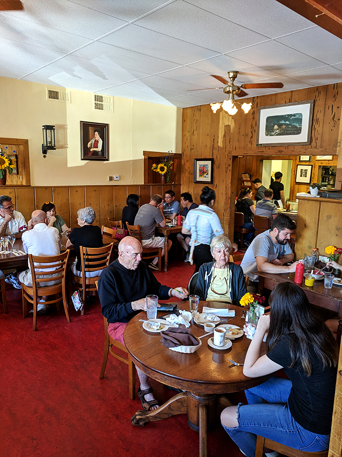 The dining room hums with multi-generational gatherings where stories are shared as freely as the bread basket&mdash;the true essence of community dining. 
