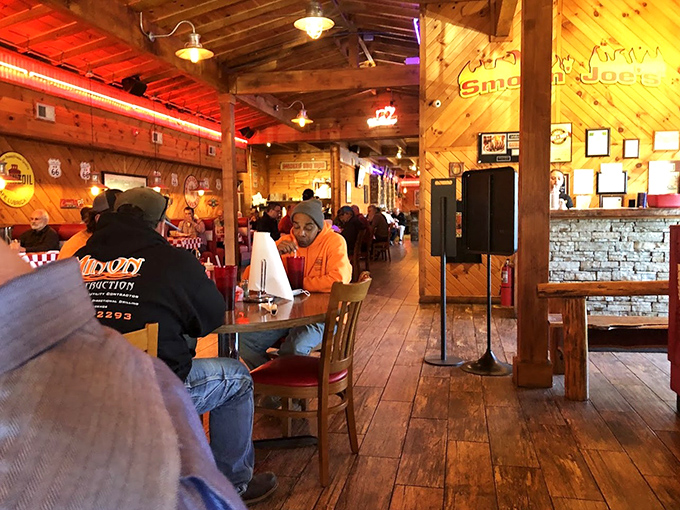 Where strangers become neighbors over plates of barbecue. The warm glow of wood paneling makes everyone look like they're in a commercial for happiness.