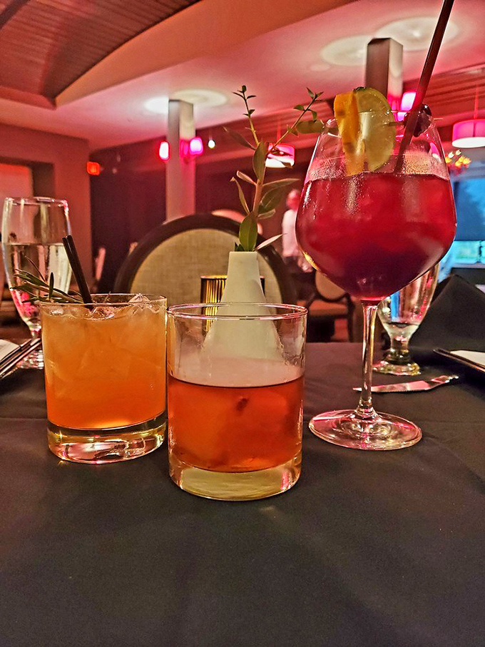 Liquid artistry in three acts. These cocktails aren't just drinks; they're conversation starters with garnishes that deserve their own spotlight.
