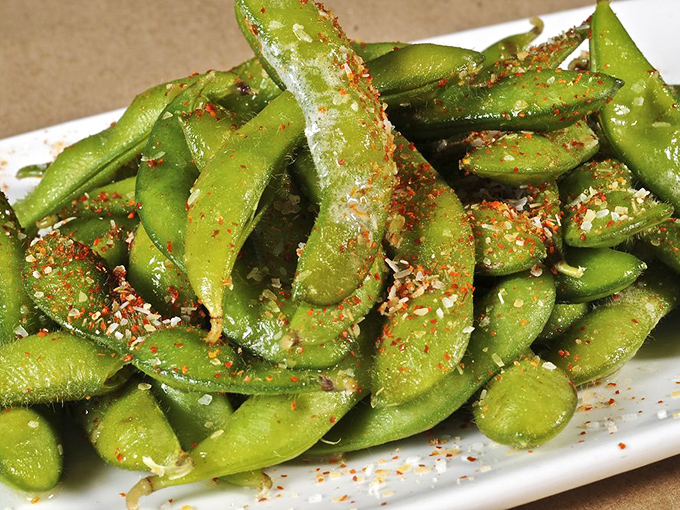 Edamame pods dusted with spice&mdash;proof that even the simplest appetizers deserve thoughtful preparation and a little extra pizzazz. 