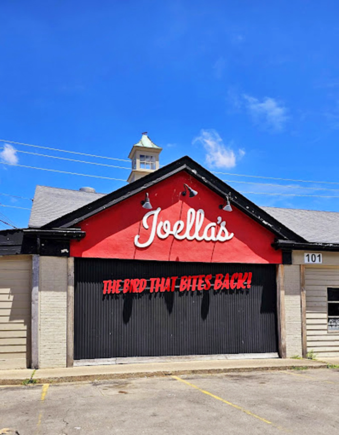 The red facade and bold lettering aren't just signage&mdash;they're a beacon for flavor seekers, standing proud against the Kentucky sky like a spicy lighthouse.