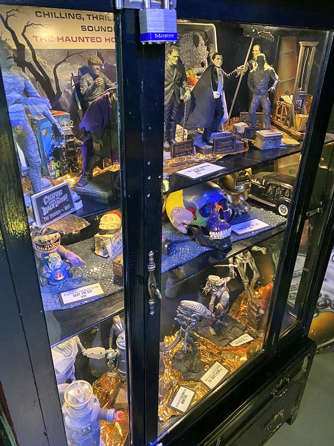 Horror movie memorabilia meets scientific specimens in this carefully curated cabinet. Each shelf tells a different macabre story.
