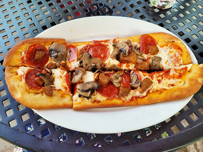 This flatbread pizza&mdash;perfectly bubbled edges surrounding pepperoni and mushrooms&mdash;proves simple pleasures executed with care remain life's most reliable delights.