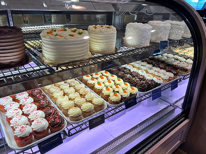 Cupcake heaven exists, and it's behind this glass. Rows of perfectly frosted treats stand at attention, waiting for their moment of glory.