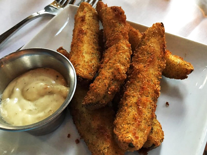 Fried pickles aren't just an appetizer; they're a Southern handshake. Crispy, tangy, and paired with a dipping sauce that makes ketchup feel like it needs to try harder.