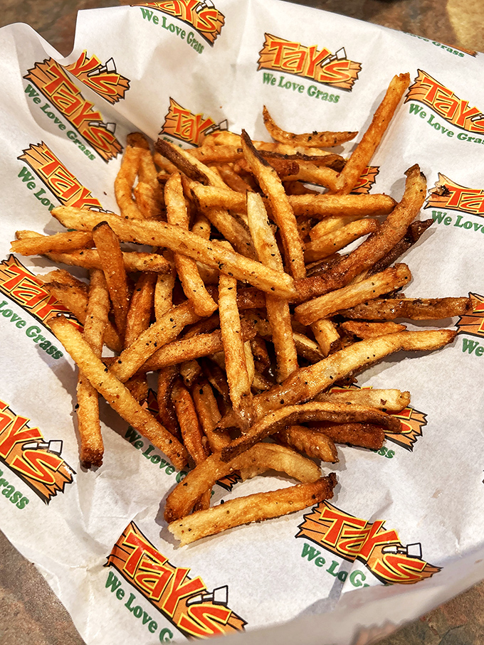These aren't just fries—they're golden potato matchsticks of joy, seasoned with enough spices to make your taste buds throw a parade.