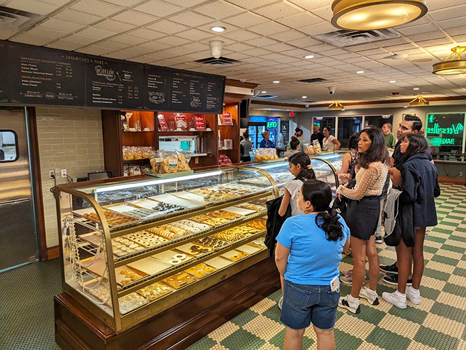 The bakery counter&mdash;where sweet dreams are made of guava pastries, and who am I to disagree? Join the line of pilgrims seeking sugar salvation.