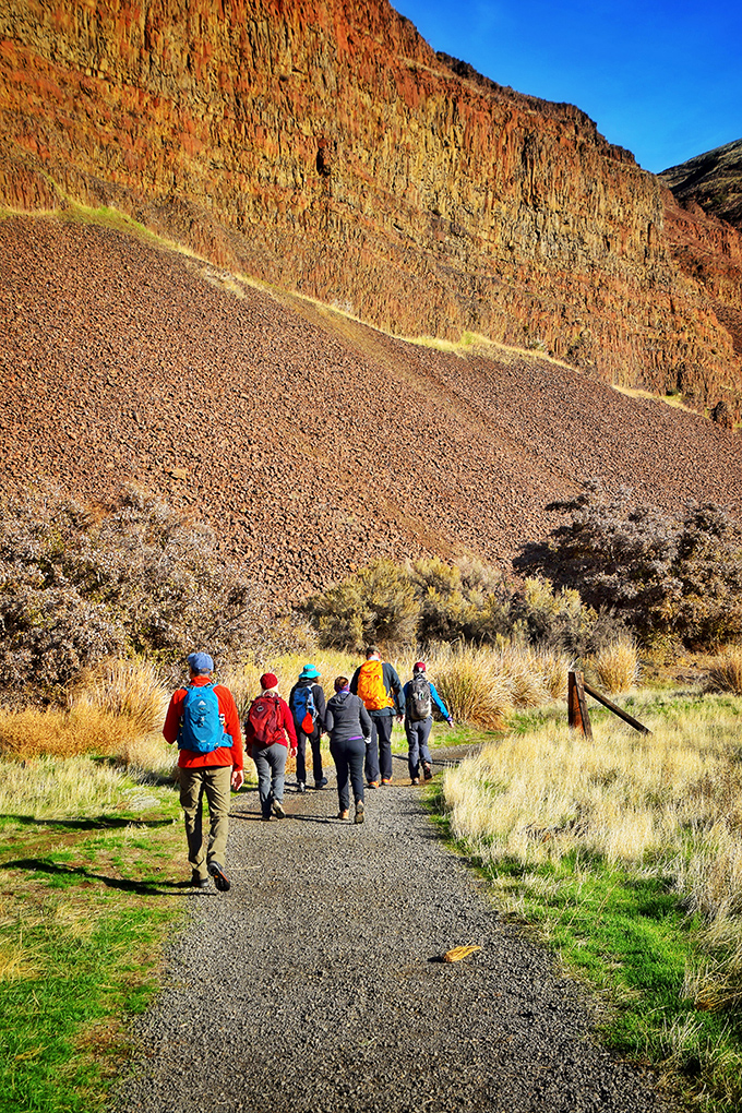 Hiking here isn't about conquering nature but becoming part of it. These travelers follow paths where indigenous peoples and settlers once walked. 