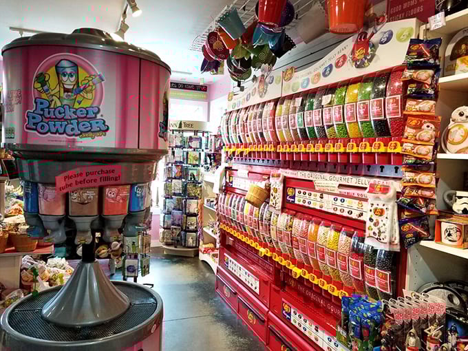 A wall of jellybeans and dispensers creates a DIY candy laboratory where you're suddenly the mad scientist of your own sugary destiny.