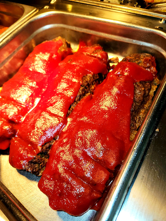 Meatloaf wearing its Sunday best&mdash;a glossy coat of tomato sauce that says, "I might be humble, but I clean up nice."