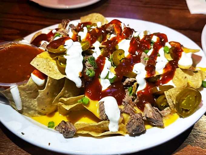 Nachos that laugh in the face of personal portion sizes &ndash; a mountain of joy that demands to be shared with the table.
