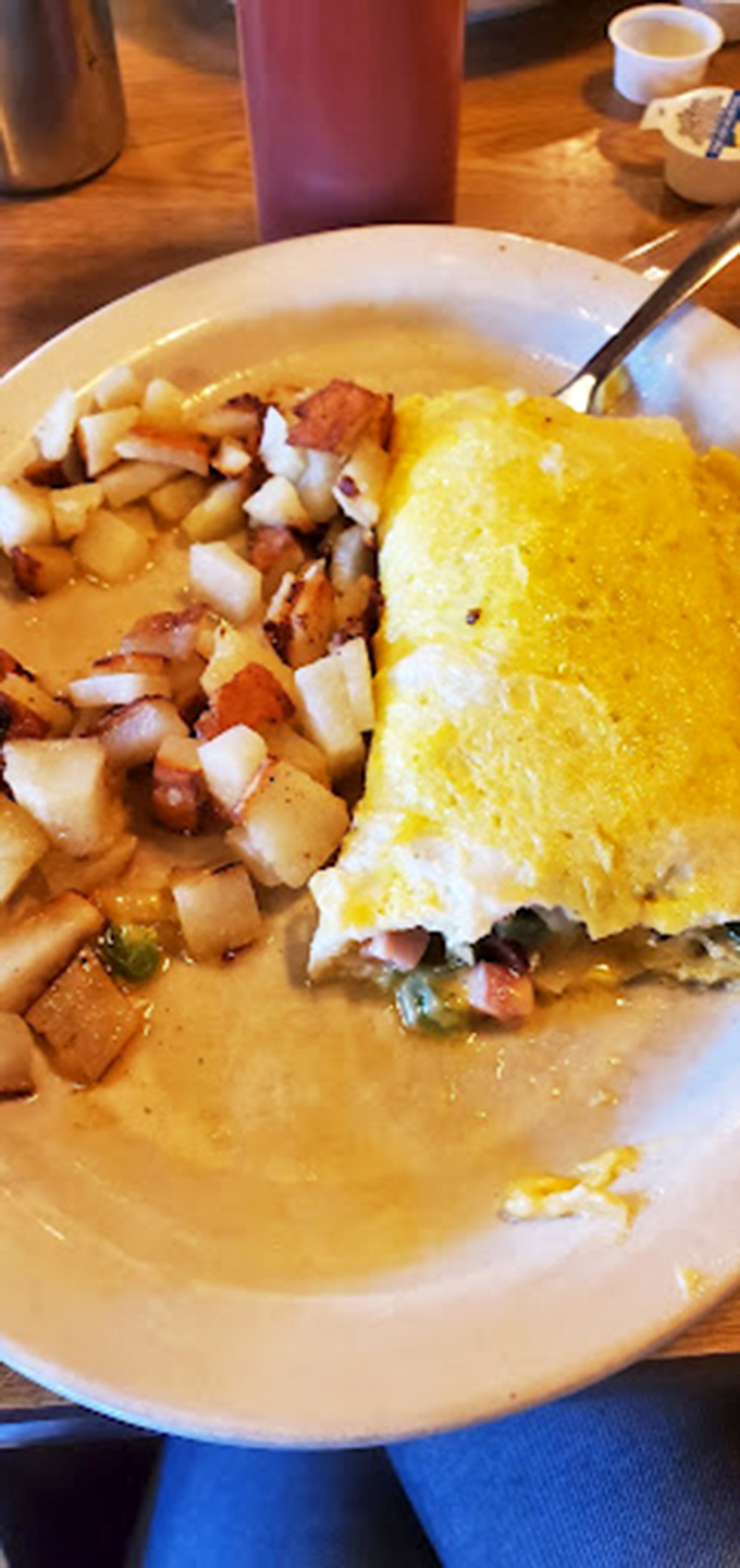 That Western omelet is holding enough fillings to qualify as real estate. The home fries aren't a side&mdash;they're an essential supporting character.