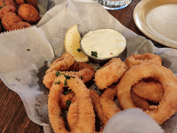 Golden rings of onion, fried to perfection, waiting to be dunked in creamy sauce. Vegetables have never been so gloriously corrupted.