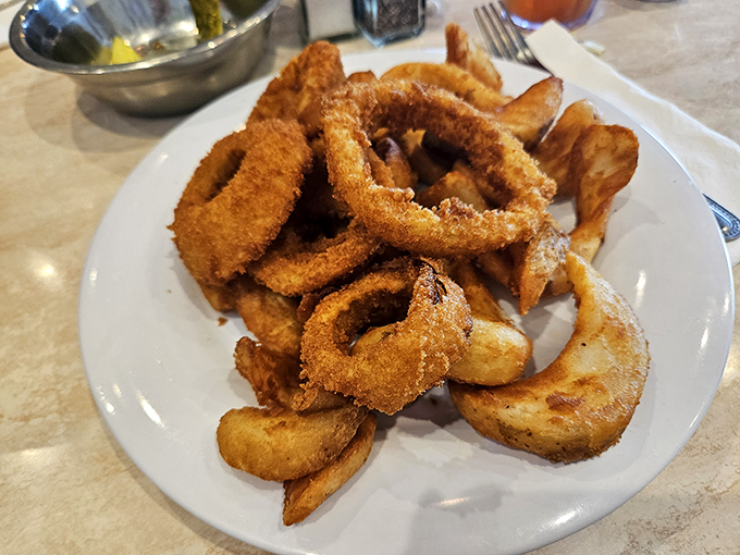 Onion rings crispy enough to make you forget your manners. These golden halos deserve their own fan club and social media following.