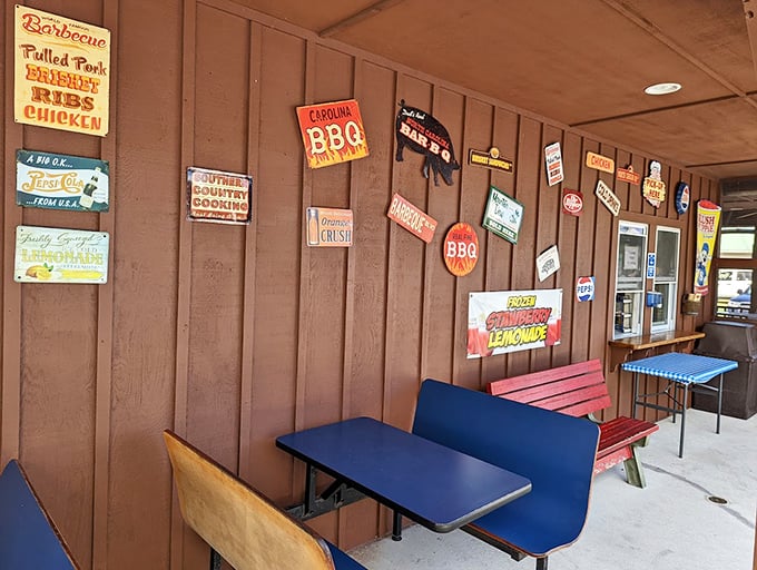 Colorful outdoor seating where barbecue dreams come true. Those vintage signs aren't decoration—they're badges of honor in the smoke-ring universe.