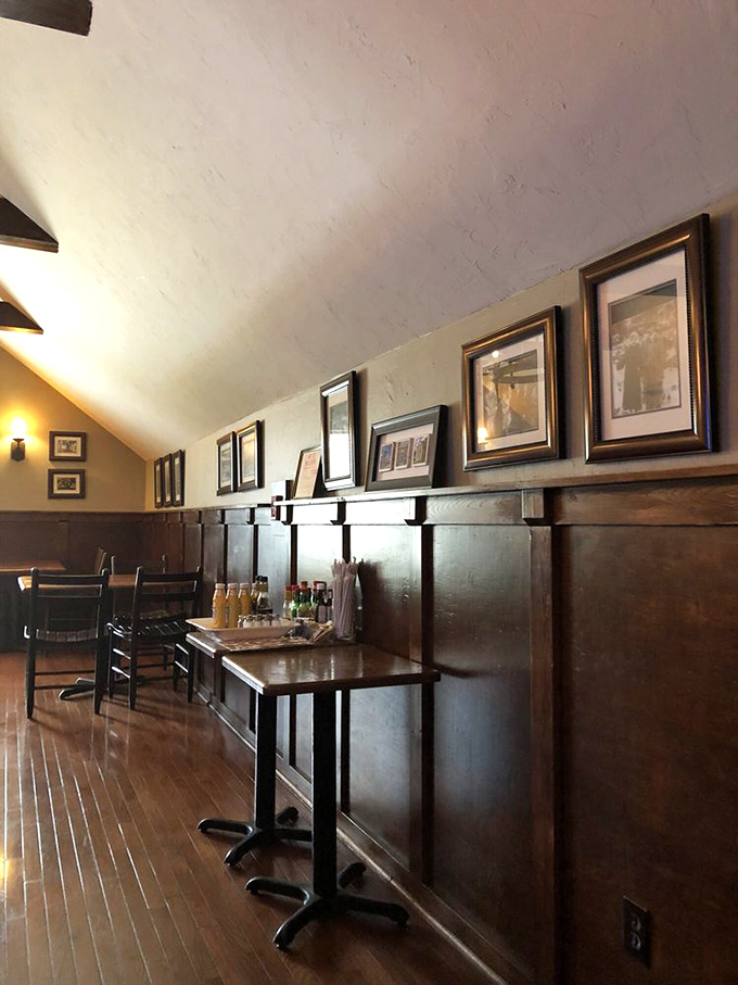 Dark wood paneling and tasteful framed prints create the dignified ambiance of a pub that's been standing for centuries&mdash;even if it hasn't.