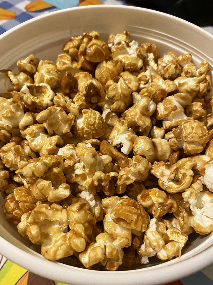 Caramel popcorn so perfectly glazed it practically glows. One handful is never enough of this sweet, crunchy masterpiece.