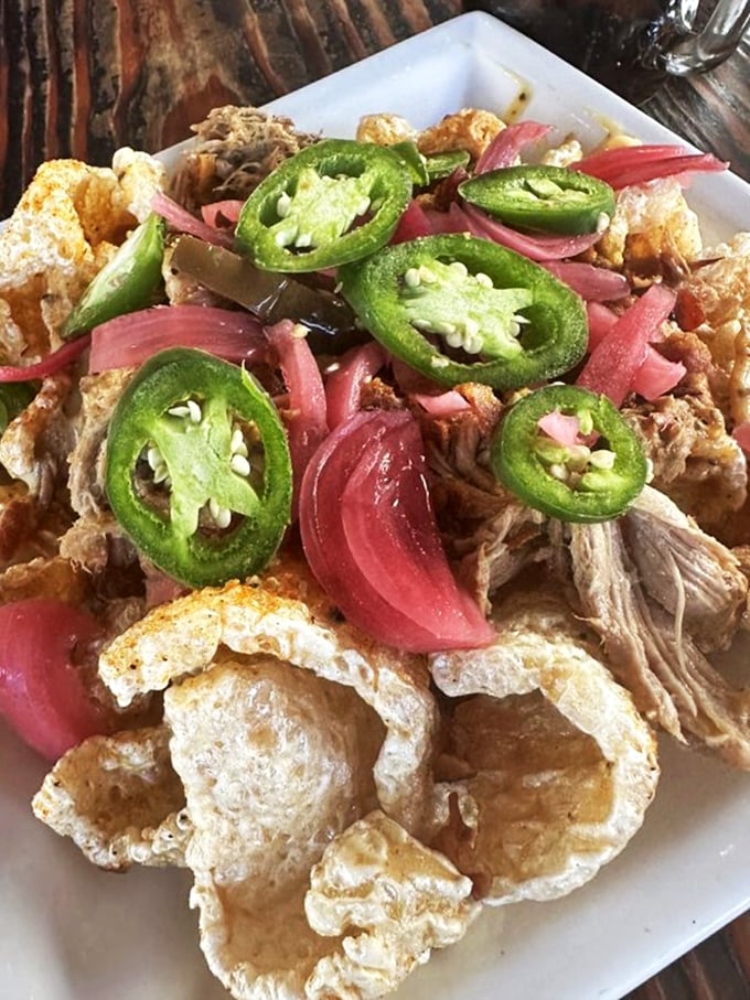 Pork rinds elevated with pickled onions and jalape&ntilde;os&mdash;proof that bar snacks can be both nostalgic and surprisingly complex.