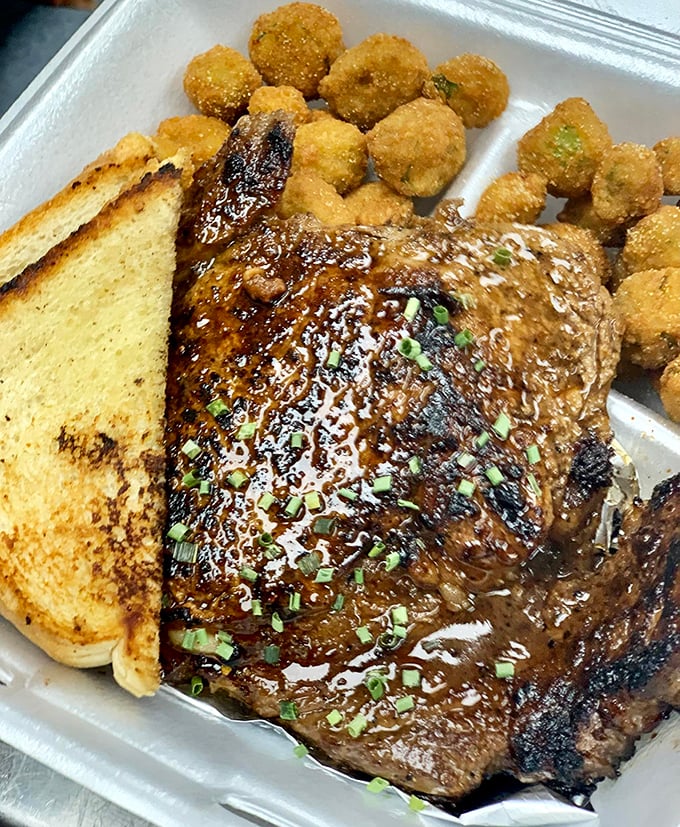 This isn't just steak &ndash; it's a carnivore's dream, glistening with savory promise and paired with golden-fried okra that grandma would approve.