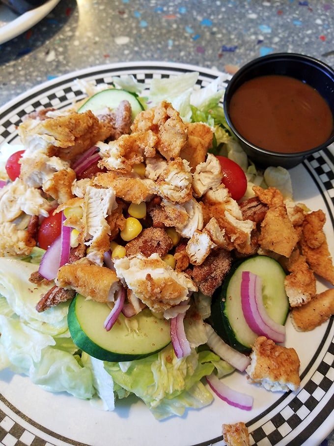 This banana split isn't just dessert&mdash;it's three scoops of childhood nostalgia topped with whipped cream mountains and cherry beacons of joy.