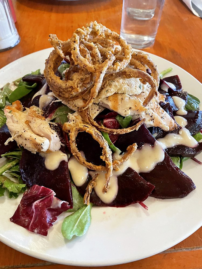 A beet salad that proves vegetables can be the main event, especially when topped with crispy onions and grilled chicken. 