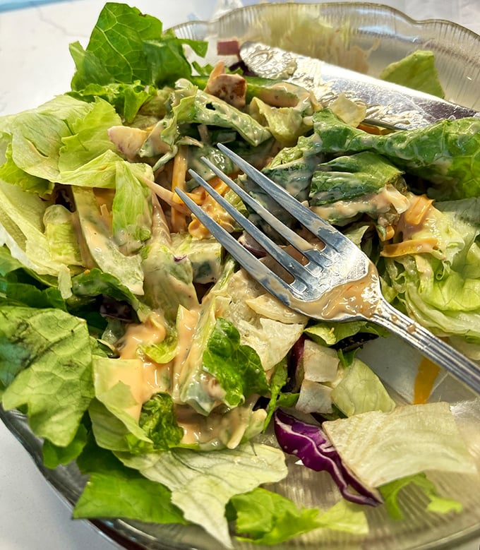 This isn't just a salad&mdash;it's a strategic arrangement of crisp lettuce and creamy dressing that somehow makes virtue feel like indulgence.