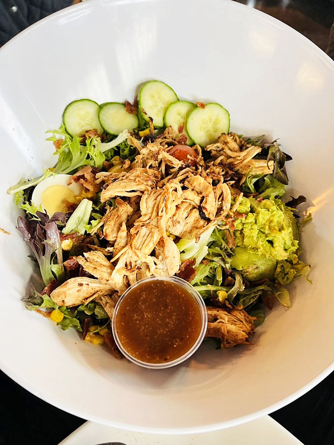 This isn't just a salad&mdash;it's a garden party in a bowl, with pulled chicken, fresh vegetables, and a dressing that ties everything together like a good host.