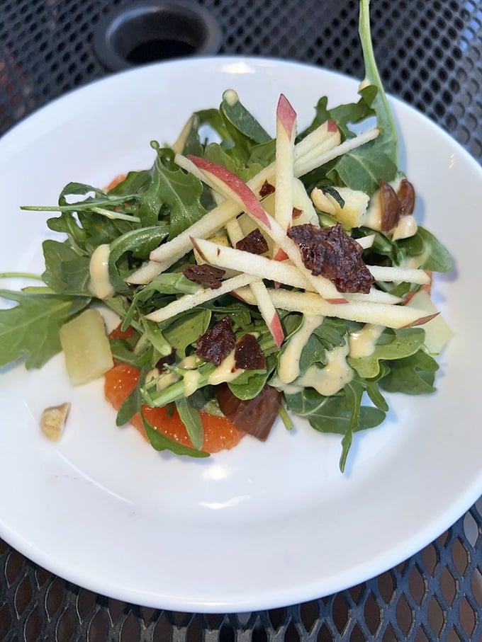 A salad that doesn't apologize for being healthy. Crisp apples, peppery arugula, and thoughtful garnishes create a refreshing counterpoint to chocolate indulgences.