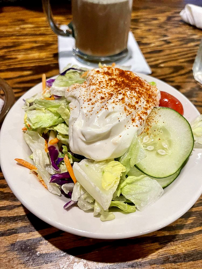 Even the salad knows its supporting role in this meat-centric drama, showing up fresh and crisp without trying to steal the spotlight.