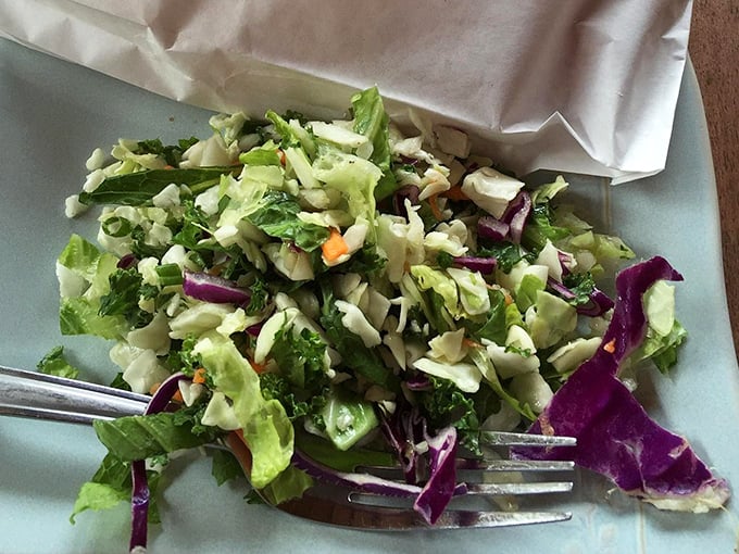 Yes, they serve salad. A noble attempt at balance, like wearing running shoes to the pie shop. Points for effort!