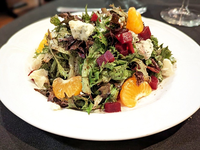 A salad that defies the "rabbit food" stereotype. Vibrant greens, citrus, and what appears to be beets create a symphony of flavors that could convert any carnivore. 