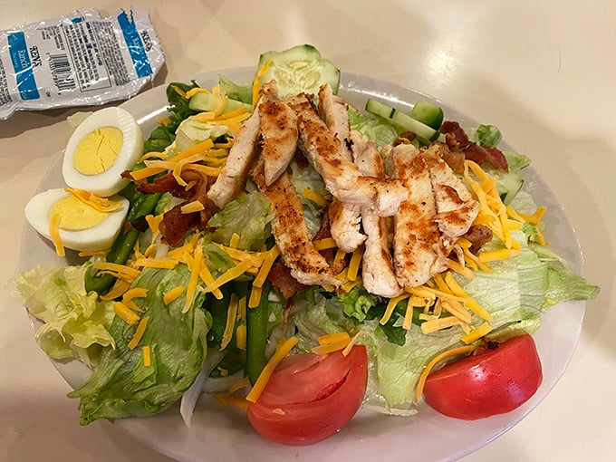 A grilled chicken salad that somehow makes virtue feel indulgent&mdash;the diner's nod to those who want to pretend they're eating healthy.