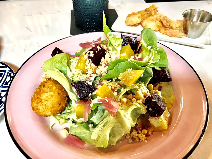 A salad that actually excites &ndash; vibrant greens, roasted beets, and what appears to be a perfectly golden croquette playing the role of delicious co-star.