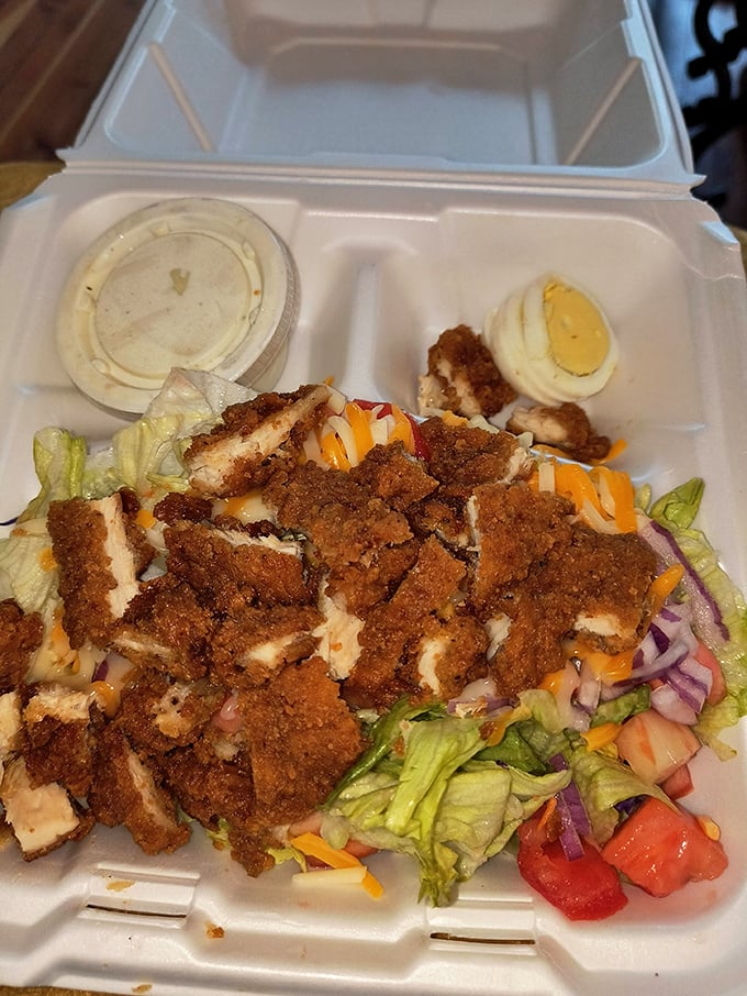 This isn't just a salad&mdash;it's a protein delivery system disguised as something healthy, topped with enough fried chicken to make a vegetarian weep.
