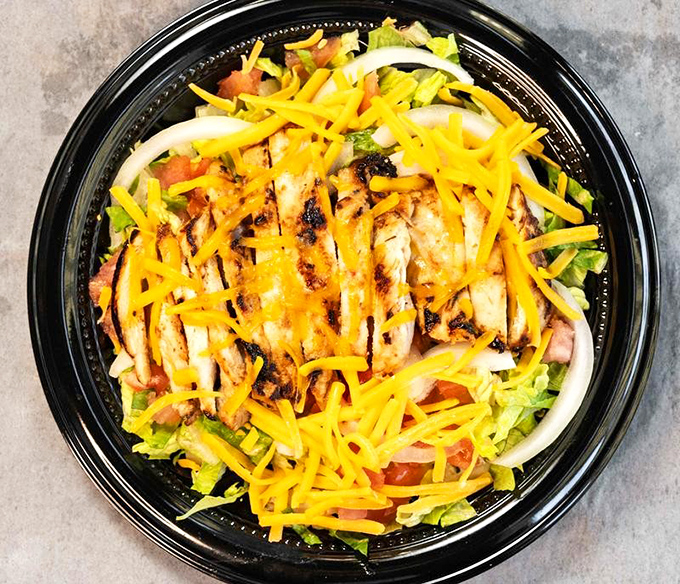 A garden salad that politely says, "I'm here if you need me," while knowing what you really came for.