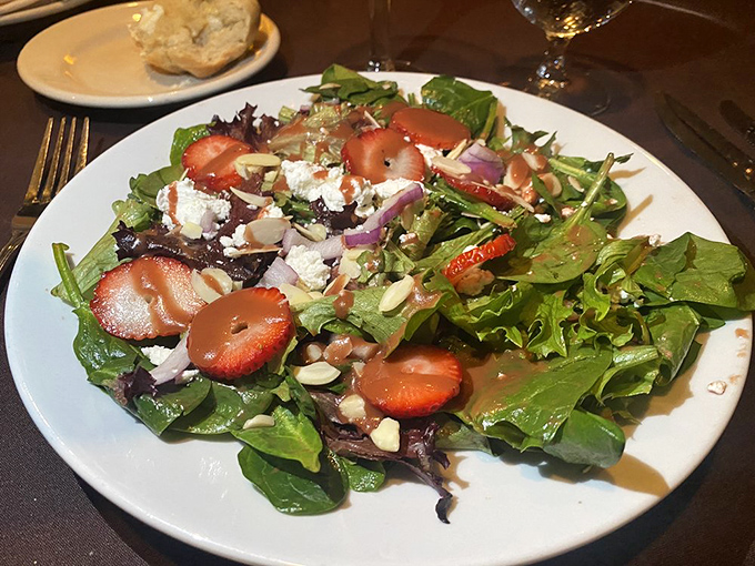 This isn't just any salad &ndash; it's the supporting actor that deserves its own award, brightening the plate with strawberries and greens.