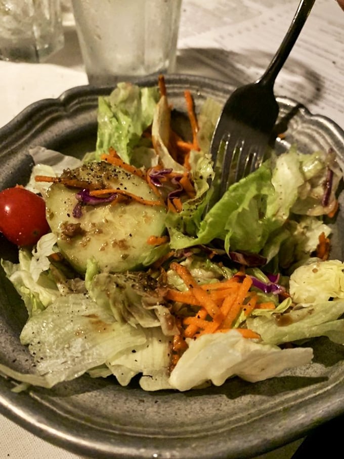 A house salad that knows its supporting role—fresh, colorful, and perfectly dressed to prepare your palate for the star attraction.