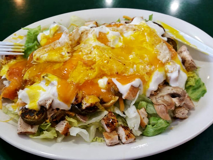 When salad gets serious about flavor. This isn't rabbit food &ndash; it's a protein-packed masterpiece topped with what appears to be liquid gold.