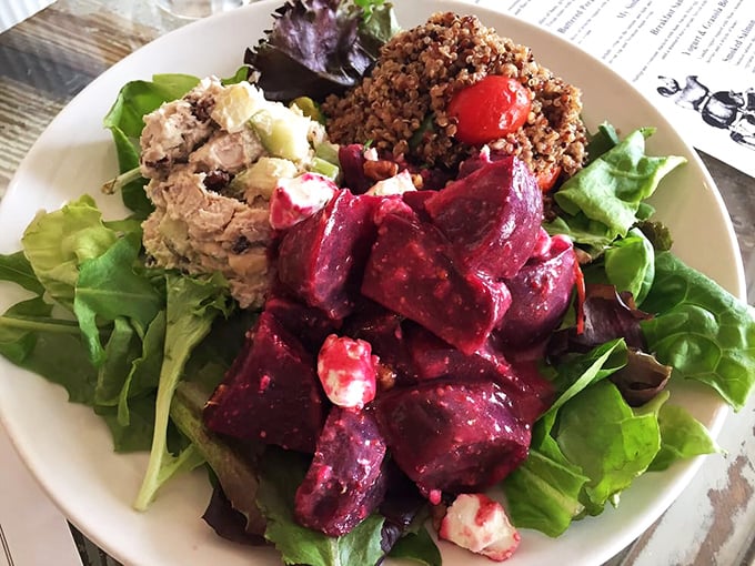 The dining area where mismatched chairs somehow create perfect harmony. That sewing machine table base is the conversation starter you didn't know you needed.