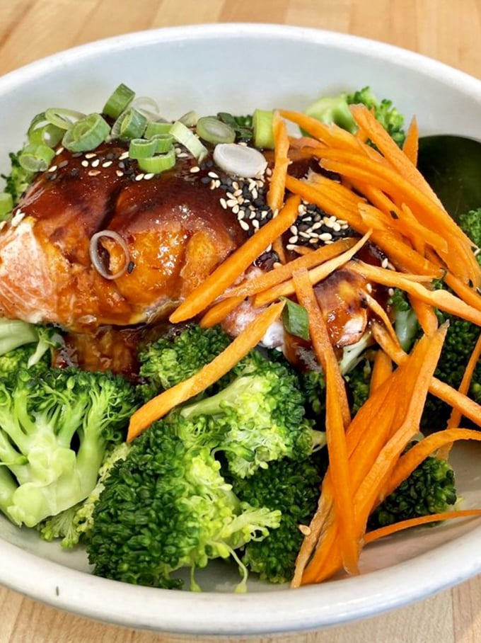 Vibrant veggies and perfectly glazed salmon create a bowl that's as nutritious as it is delicious. Proof that healthy eating needn't be punishment. 