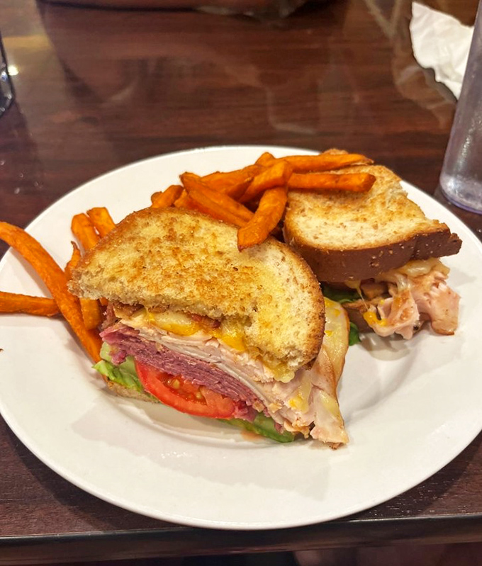 This isn't just a sandwich &ndash; it's towering architecture of deliciousness where meats, cheeses and veggies find harmony between toasted bread.