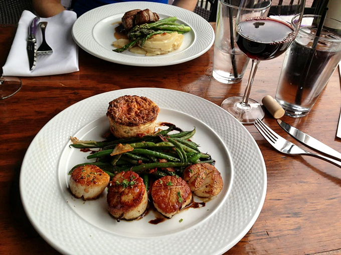 Perfectly seared scallops with a golden crust that would make King Midas jealous, arranged like delicious little hockey pucks of the sea.