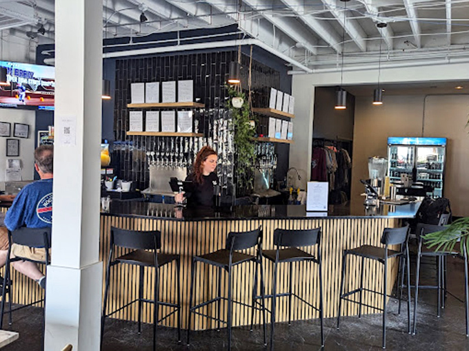 Where the magic happens—skilled hands orchestrating the perfect pour while patrons contemplate their next flavor adventure.